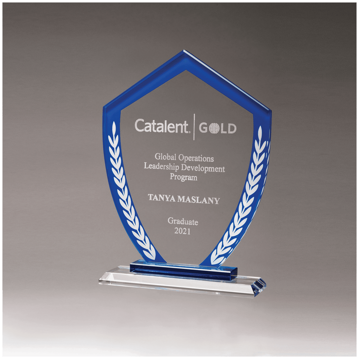 Thick Shield Shaped Glass Award with Blue Border and White Laurel Leav ...